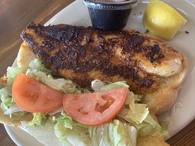 This blackened grouper sandwich isn't just food—it's edible poetry with a spice rub that deserves its own Grammy nomination.