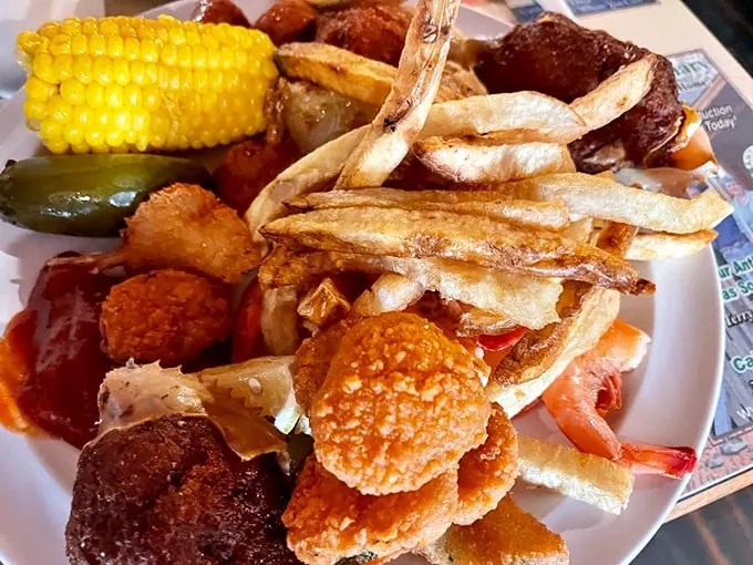 When your plate looks like a delicious game of Tetris – crispy fries, corn on the cob, and enough fried goodness to make you forget vegetables exist.