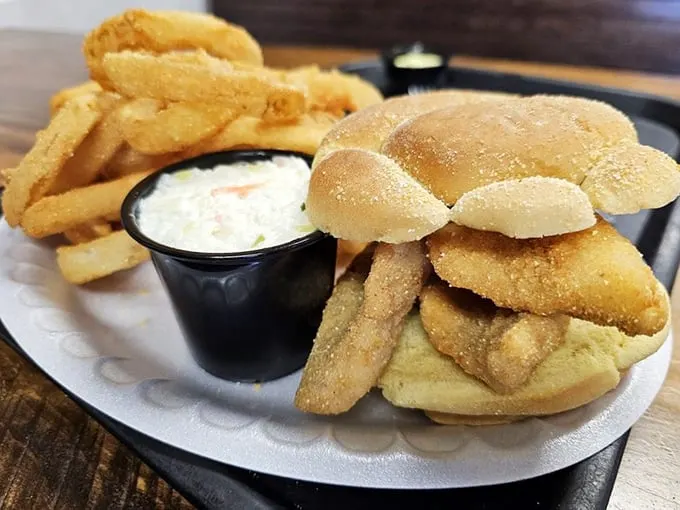 A perfectly stacked perch sandwich that makes fast food fish fillets weep with inadequacy. That golden-brown crust is what deep-fried dreams are made of.