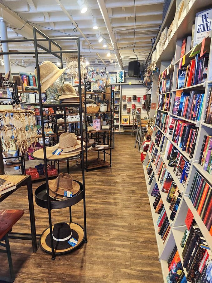 Straw hats and bestsellers—an unexpected but perfect pairing in this corner where beach reads meet actual beach accessories.
