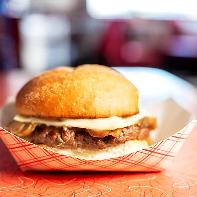 The Mushroom Burger doesn't apologize for its simplicity—just a perfect patty, melty cheese, and sautéed mushrooms in delicious harmony.