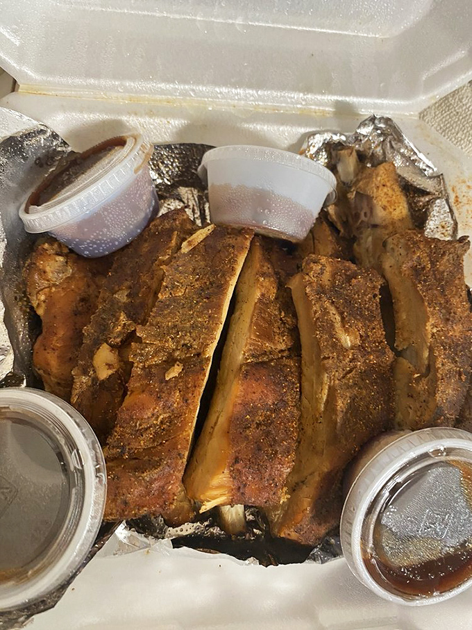 These ribs don't fall off the bone – they hang on with just enough dignity to remind you that great barbecue requires a little effort from both parties.