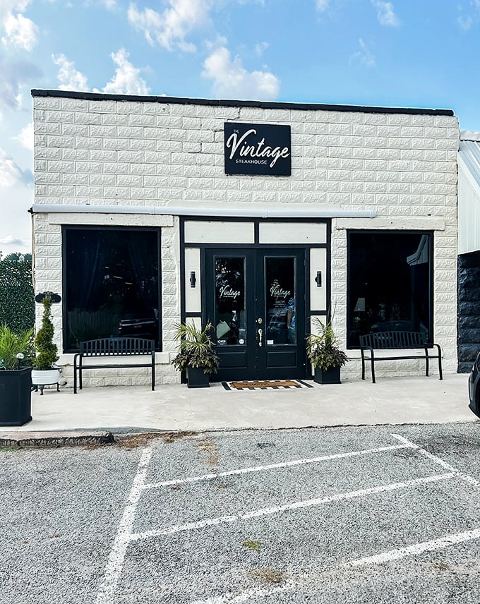 The Vintage's crisp white building is like that quiet friend who turns out to have the best stories—and steaks—in town.