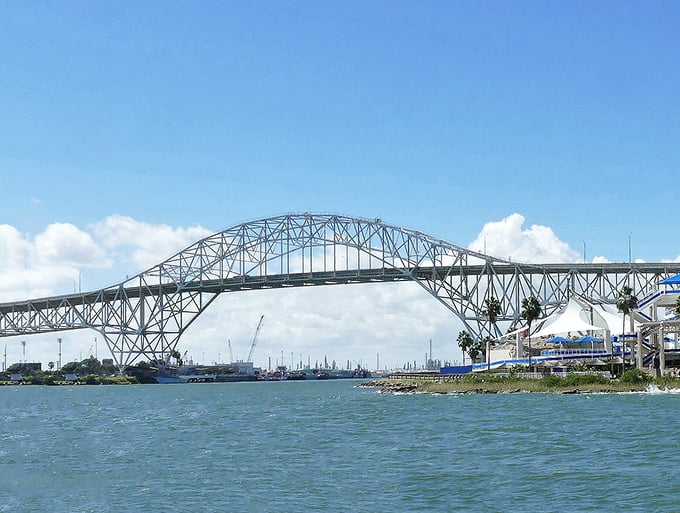 The Harbor Bridge spans Corpus Christi Bay like a giant steel rainbow leading to affordable coastal adventures.