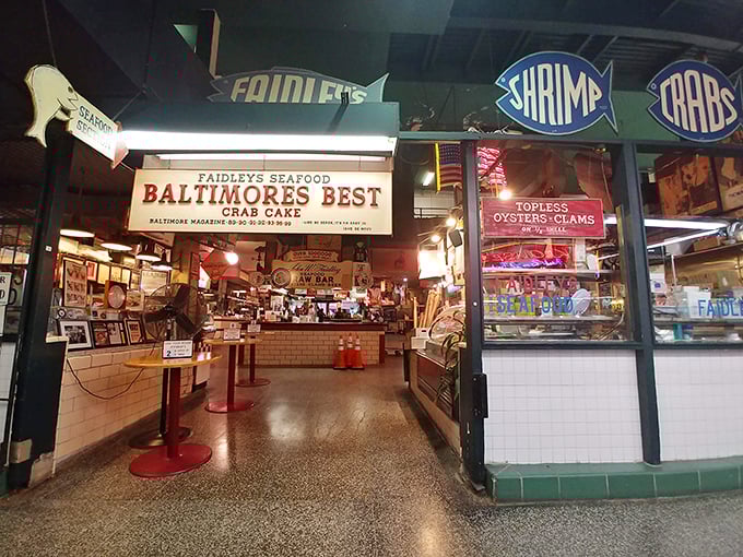 The neon signs aren't just decoration—they're beacons guiding you to crab cake nirvana in Lexington Market's bustling heart.