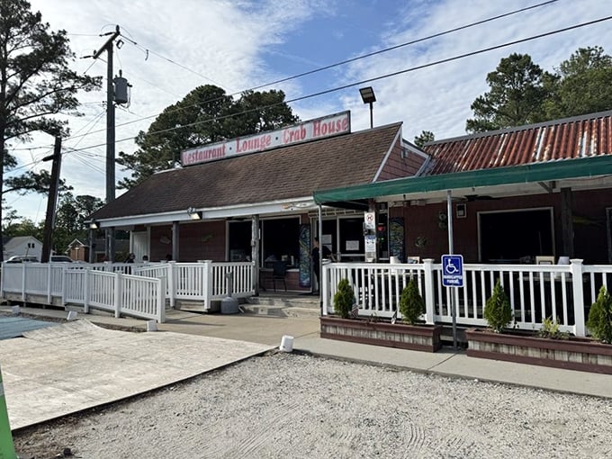 The white railing and humble exterior of Margie & Ray's conceal crab feasts that have kept families coming back for generations.