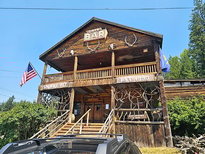 Antlers and American flags adorn The Snake Pit's frontier-style porch – a carnivore's cabin in the Idaho wilderness.