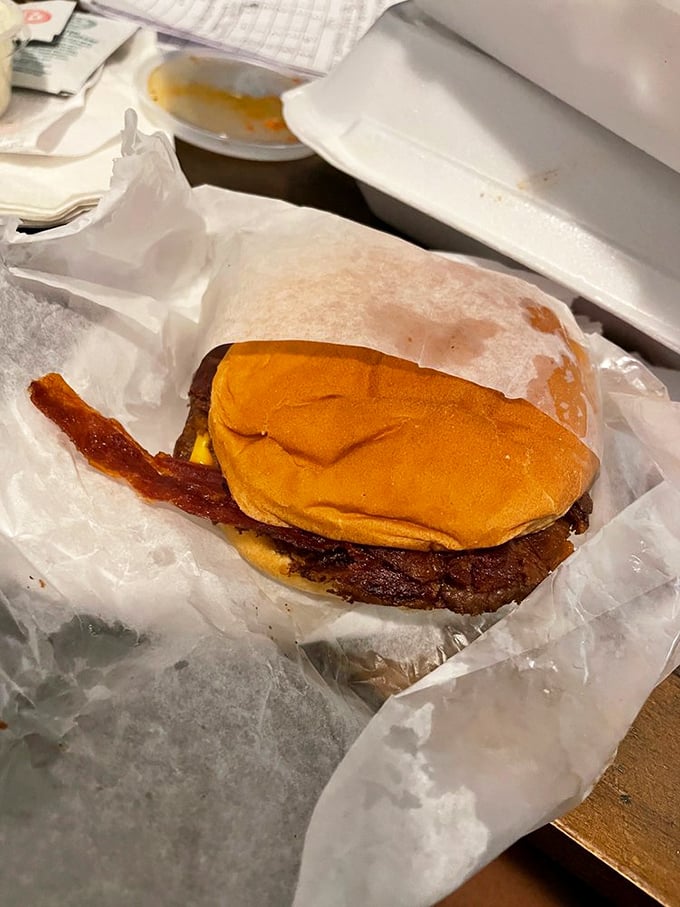The bacon cheeseburger arrives like a savory sonnet—crisp bacon adding a salty crunch to the melody of beef and cheese.