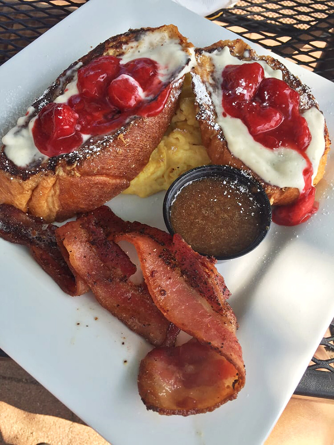 Behold the berry French toast in all its glory—where the syrup meets the fruit in a breakfast romance that puts "The Notebook" to shame. 