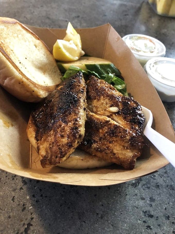Simplicity elevated to art form: grilled yellowfin tuna, fresh veggies, and a bun that knows its supporting role. Ocean-to-table doesn't get better.