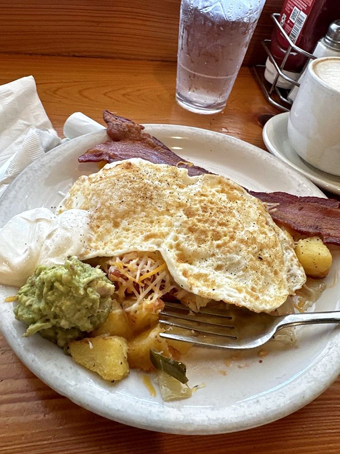 Every breakfast platter tells a story, but this one—with its perfect eggs, crispy bacon, and avocado—is writing a love letter to your taste buds.