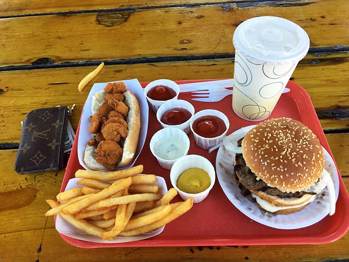The ultimate tray of indecision: burger, seafood, and condiment cups galore. When in doubt, order everything—that's my philosophy.