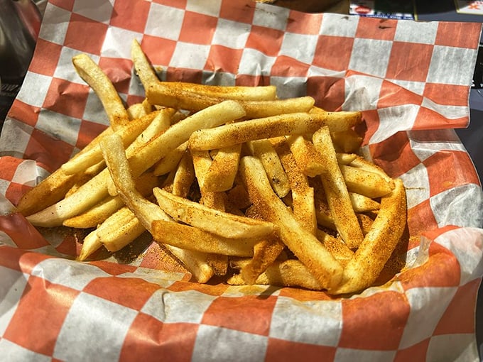 These aren't just fries – they're crispy, golden vehicles for delivering perfectly seasoned potato goodness straight to your happiness center.
