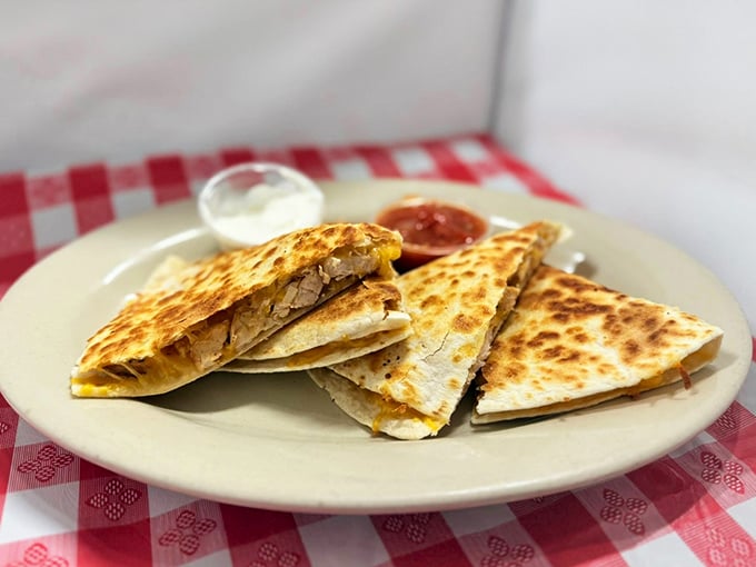 These quesadillas aren't just folded—they're architectural masterpieces of melted cheese and savory fillings that make sharing nearly impossible.