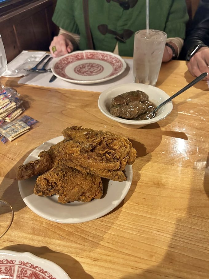 Southern diplomacy on a plate—fried chicken and country-style steak coexisting peacefully, neither willing to concede superiority.