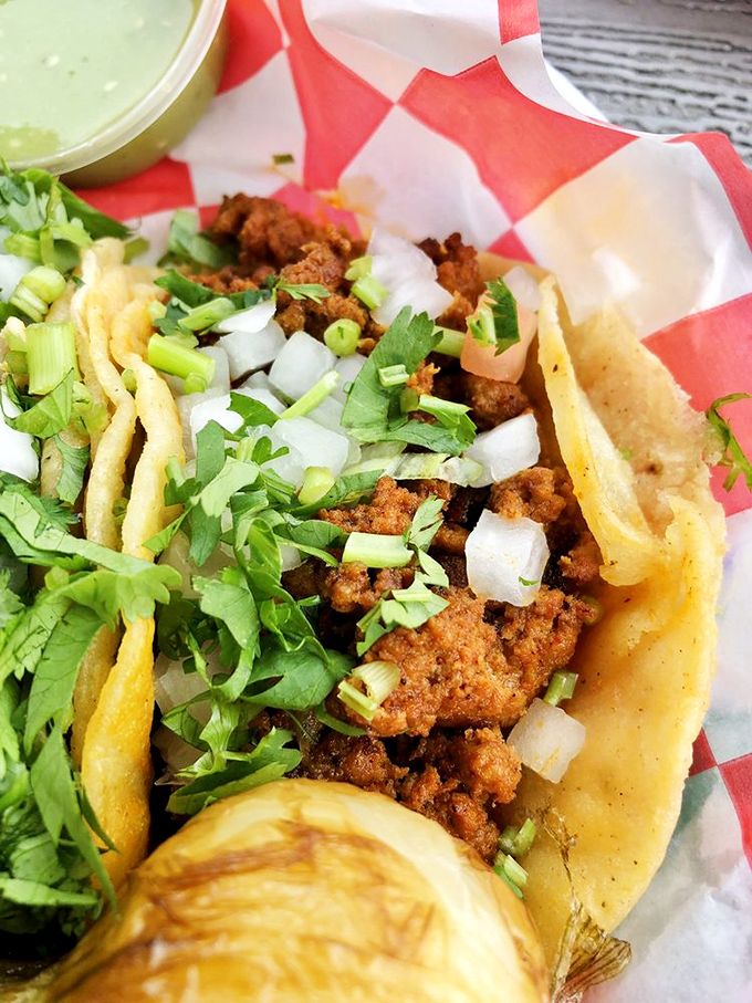 Birria tacos with melted cheese that stretches like the world's most delicious game of tug-of-war. Worth every napkin you'll need.