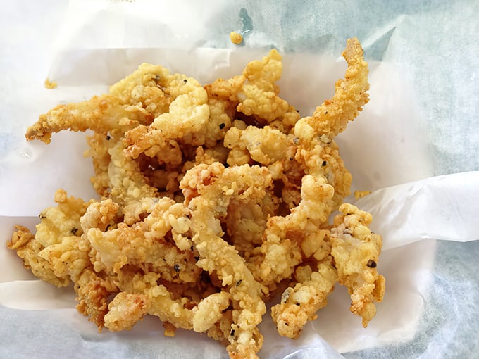 These clam strips aren't just fried—they're transformed into crispy, golden treasures that would make Neptune himself swim upstream to Minnesota.