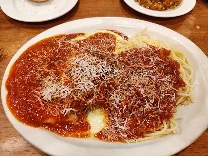 Simple pleasures done right. This classic spaghetti with marinara and a snowfall of parmesan proves you don't need complexity for culinary joy.
