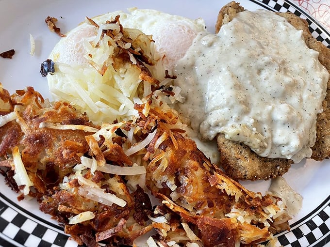 This isn't just country fried steak—it's a masterclass in comfort. The crispy exterior gives way to tender beef while that gravy performs miracles on your taste buds.