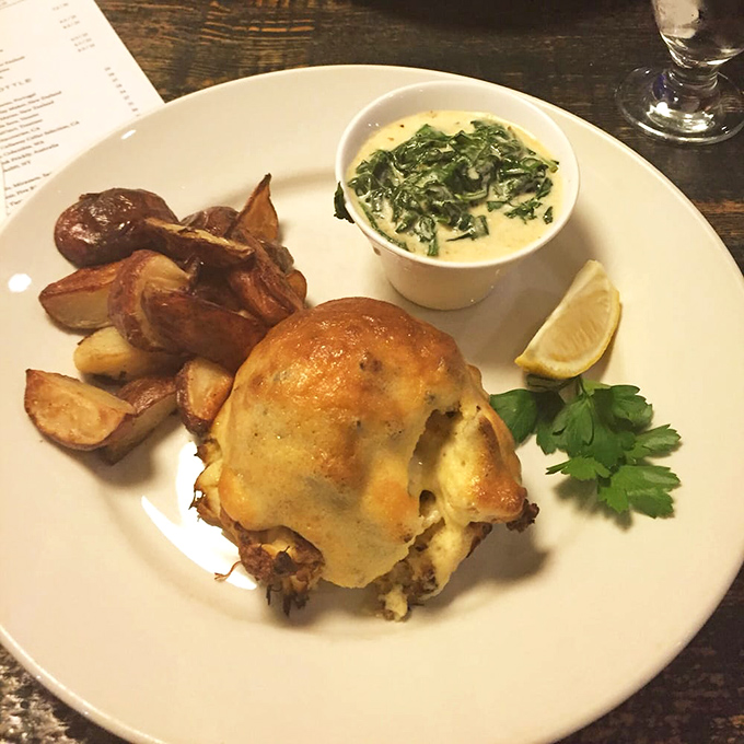 Crab cake nirvana achieved! Paired with creamy spinach and crispy potatoes, it's the kind of plate that makes conversation stop mid-sentence.