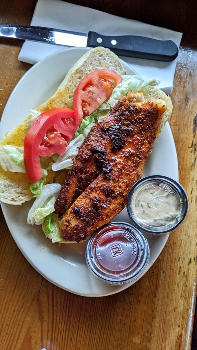 The broiled fish sandwich lounges on its bun like it knows something you don't—and after one bite, you'll be in on the secret too.