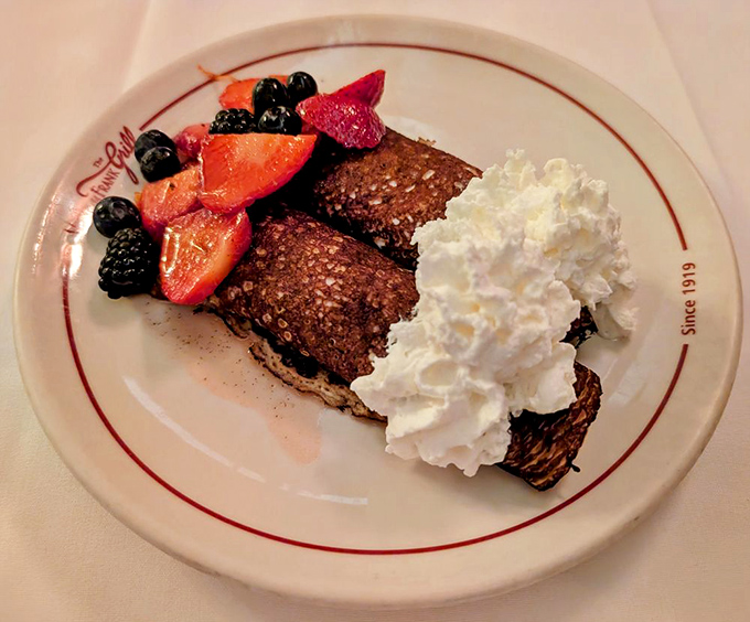 Chocolate flannel cakes with fresh berries and whipped cream—breakfast that makes you question why we ever invented cereal.