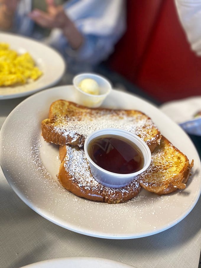 French toast dusted with powdered sugar snow and a syrup pond that's worth diving into. Breakfast doesn't get more photogenic than this.