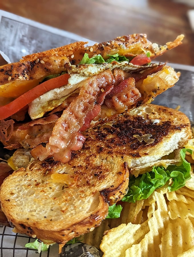 Behold the architectural marvel that is the Jacked Up BLT—where bacon doesn't just participate, it performs a starring role.