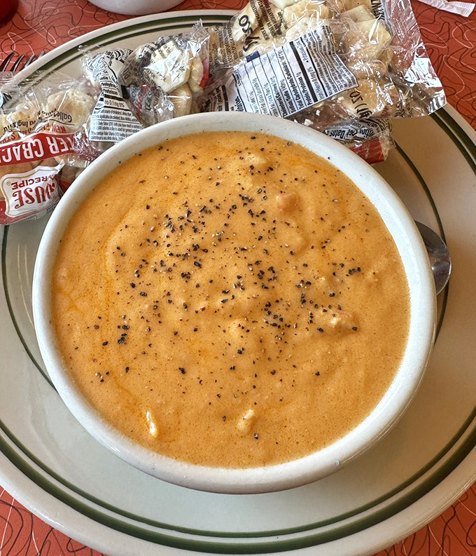 Lobster bisque that could make a New Englander homesick. Velvety, rich, and speckled with pepper—comfort in a bowl with crackers standing by.