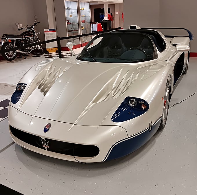 The Maserati MC12 stands like an Italian spaceship that accidentally landed in Pennsylvania – its aerodynamic curves practically whisper in Italian.