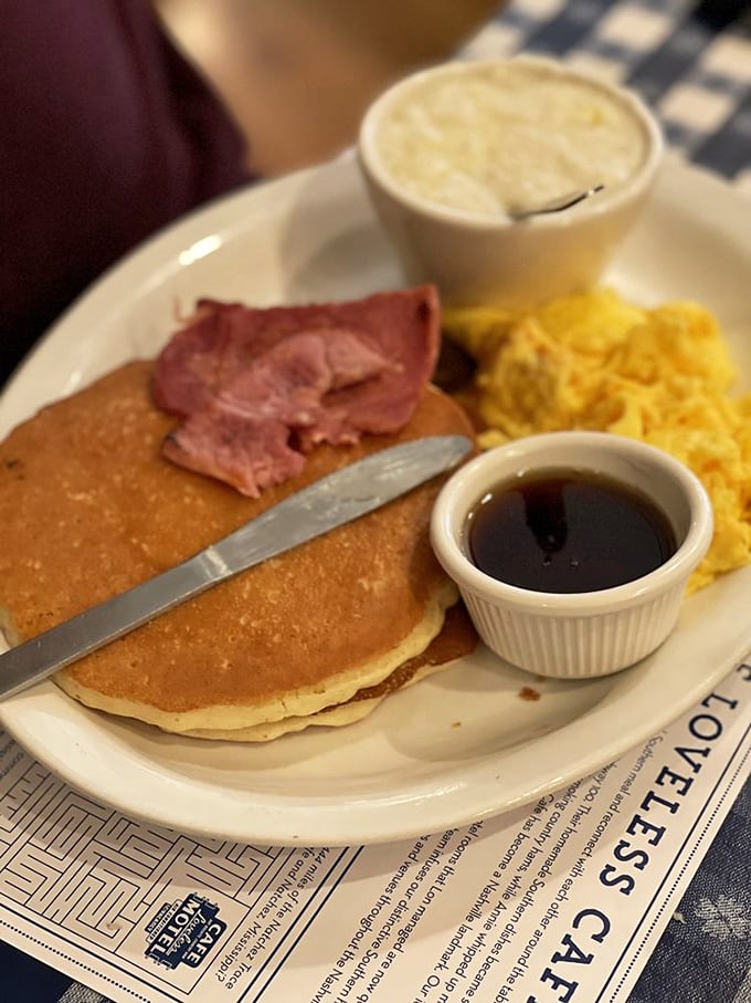 The pancake trinity: fluffy hotcakes, golden home fries, and country ham—proof that breakfast is the most important art form of the day.
