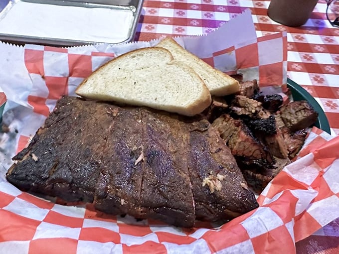 The barbecue equivalent of a greatest hits album. Brisket and ribs sharing a basket is like McCartney and Lennon sharing a stage—pure harmony on a checkered paper.
