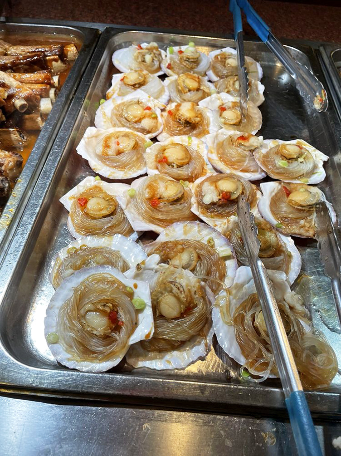 These scallops nestled in glass noodles are the buffet equivalent of finding an unexpected twenty in your winter coat—a delightful surprise worth savoring. 