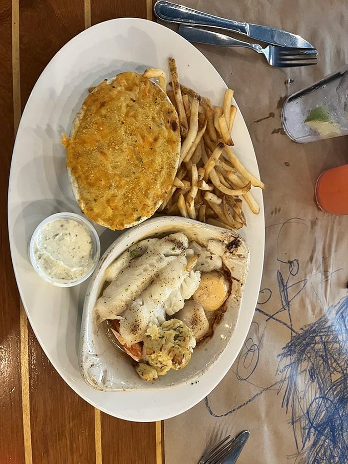 A seafood trinity – perfectly broiled fish, golden crab cake, and potatoes that received the memo about not being mere side characters.