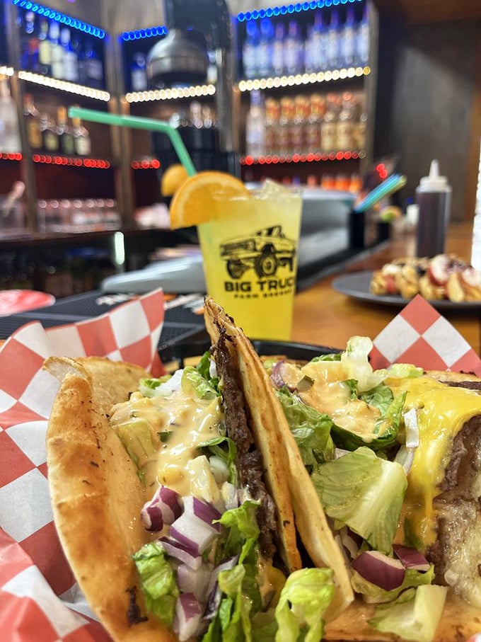 Tacos with attitude served on classic checkered paper. That yellow beverage isn't just a drink—it's sunshine in a glass waiting to brighten your day.