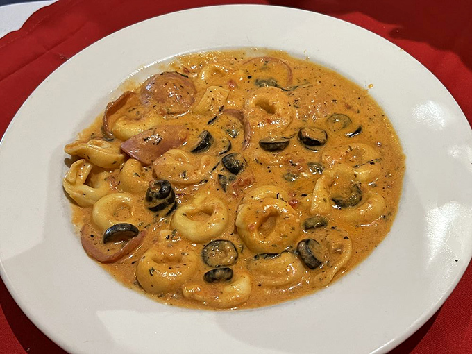 Seafood pasta that brings the Mediterranean to Mississippi. Those tender rings of calamari are doing the backstroke in sauce heaven.