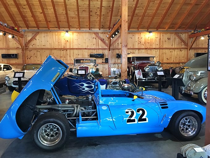 The blue racer with its exposed engine stands ready for action, a testament to when speed was mechanical art rather than digital science.