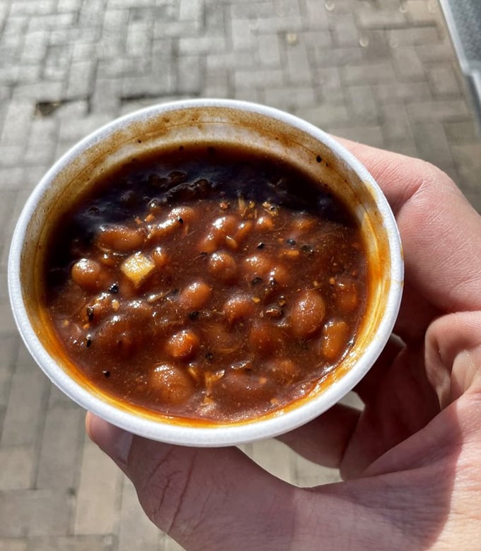 Not just beans, but a smoky, meaty miracle in a cup. Each spoonful tells the story of hours spent absorbing the essence of the smokehouse.