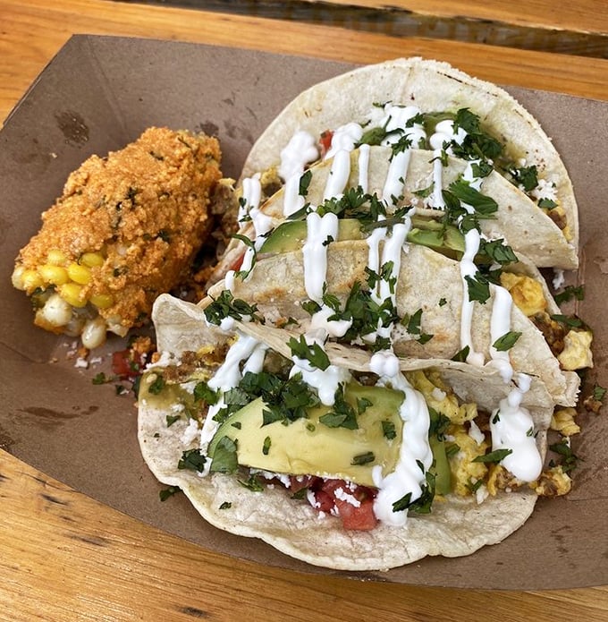 Breakfast tacos that make you question why you'd ever eat anything else before noon—fresh, vibrant, and topped with a zigzag of creamy sauce.