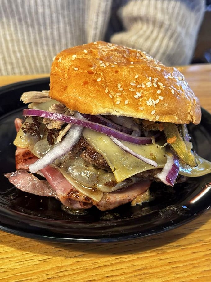 This tower of meat, cheese, and toppings isn't just a burger—it's a commitment. Your jaw will dislocate, but your taste buds will thank you.