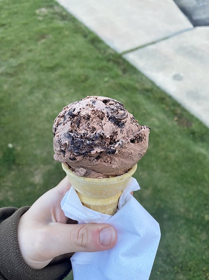 A chocolate lover's dream perched atop a freshly made waffle cone—the kind of simple pleasure that makes Monday feel like Saturday.