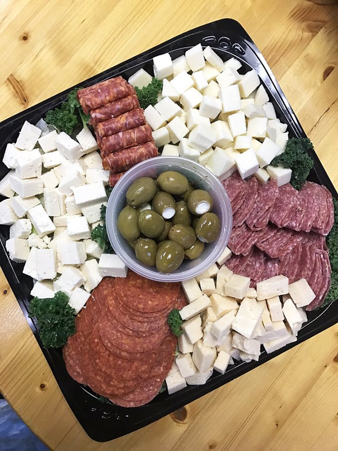This charcuterie board doesn't just feed the body—it feeds the soul. Precisely arranged meats, cheeses, and those stuffed olives that deserve their own fan club.