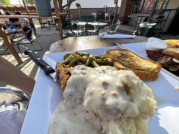 Country fried steak swimming in gravy—where comfort food goes to show off. This plate doesn't whisper "indulgence," it yells it from the mountaintops.