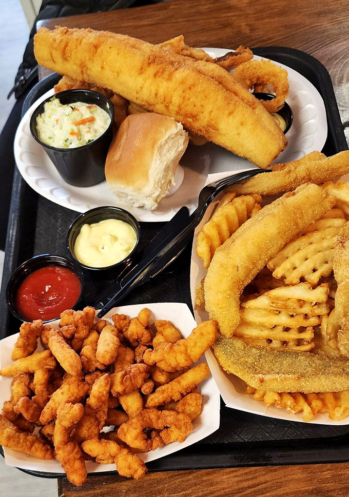 The seafood trifecta that dreams are made of. Perch, clams, and onion rings sharing a tray like old friends at a reunion—and you're invited to the party.