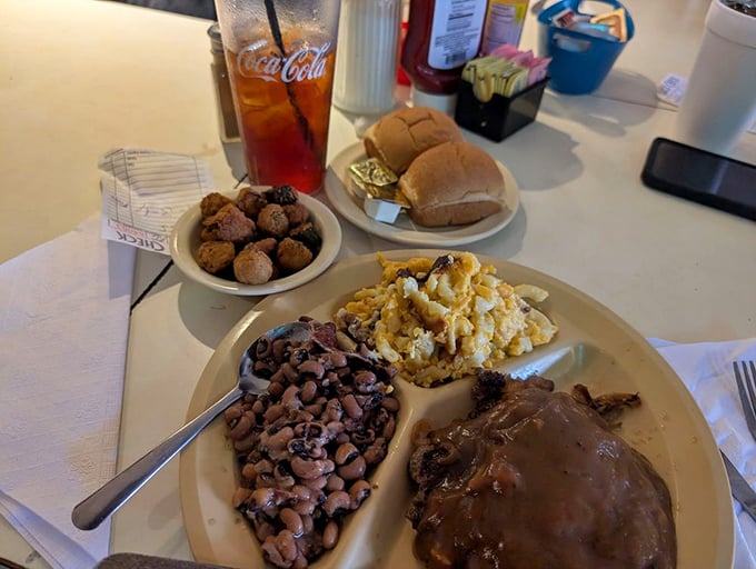 A plate that would make your grandmother proud—hamburger steak, gravy, black-eyed peas, and mac and cheese. The South's answer to Prozac.