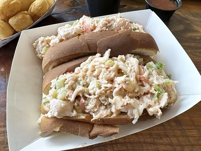 Lobster roll perfection that would make even a New Englander pause mid-sentence. That generous portion isn't showing off—it's just Midwest hospitality in sandwich form.