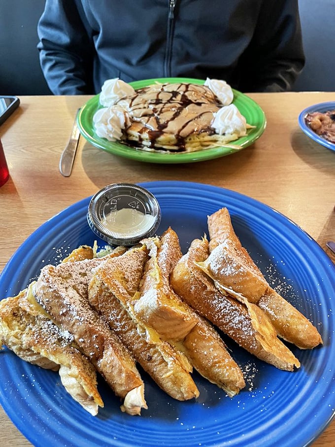 Pancakes drizzled with chocolate and crowned with whipped cream share the table with golden French toast—breakfast's greatest hits album.