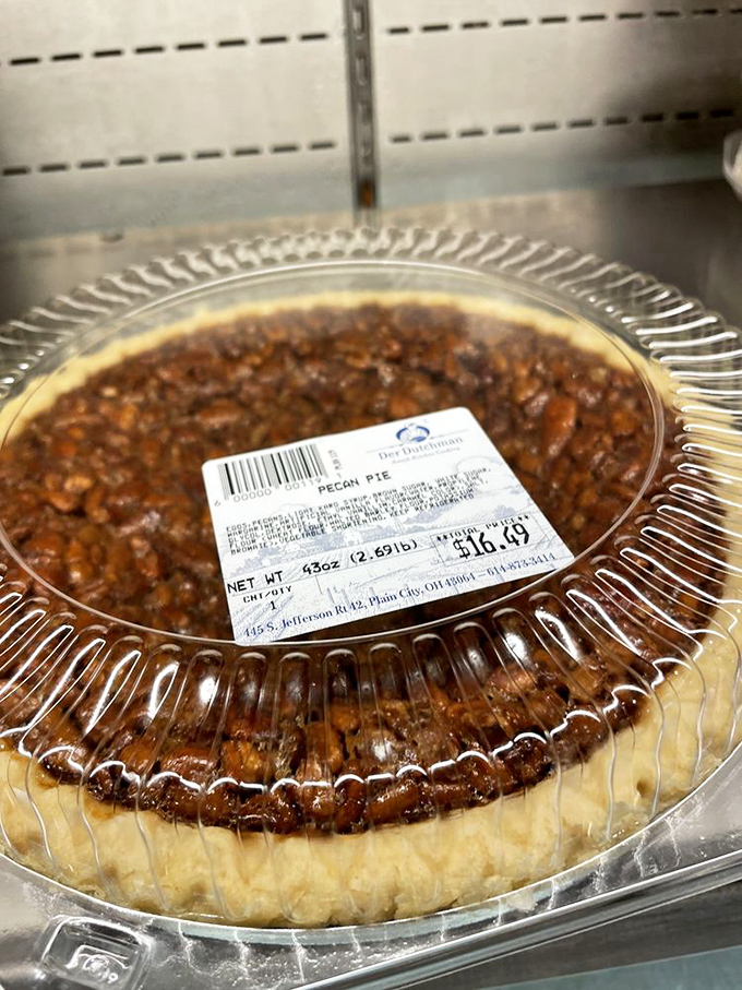 This pecan pie doesn't just have nuts—it has a congregation of pecans holding a revival meeting in buttery caramel that'll convert even the most devoted diet-follower.