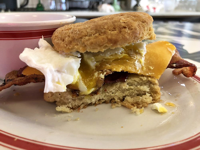 Breakfast sandwich nirvana—runny egg, crispy bacon, and melty cheese on a housemade biscuit that would make your Southern grandmother nod in approval.