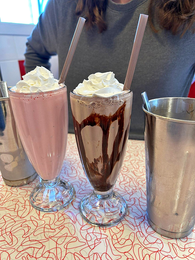 Pink meets chocolate in a milkshake showdown. These aren't those wimpy fast-food imposters—these are hand-spun monuments to dairy excellence that demand your respect.